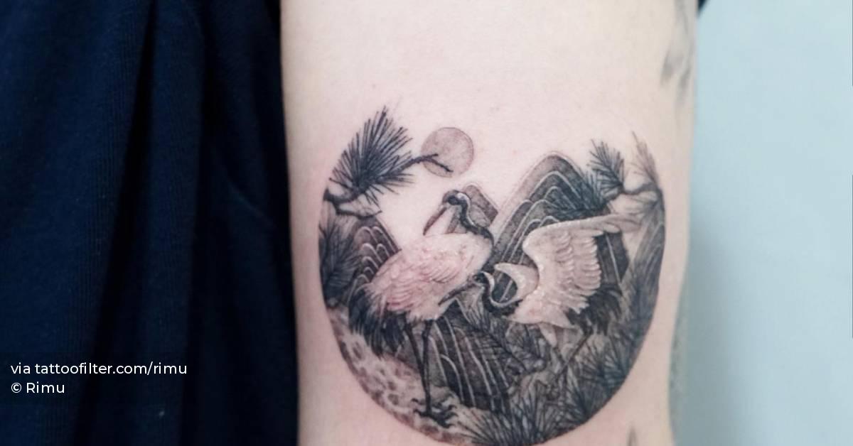 Cranes tattoo located on the upper arm.