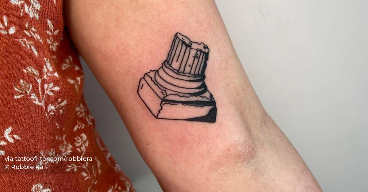 Hand poked column tattooed on the inner arm.