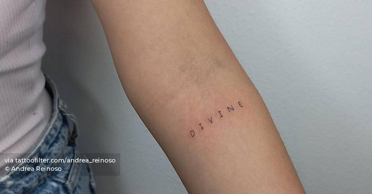 Tattoo of the word "divine" located on the inner