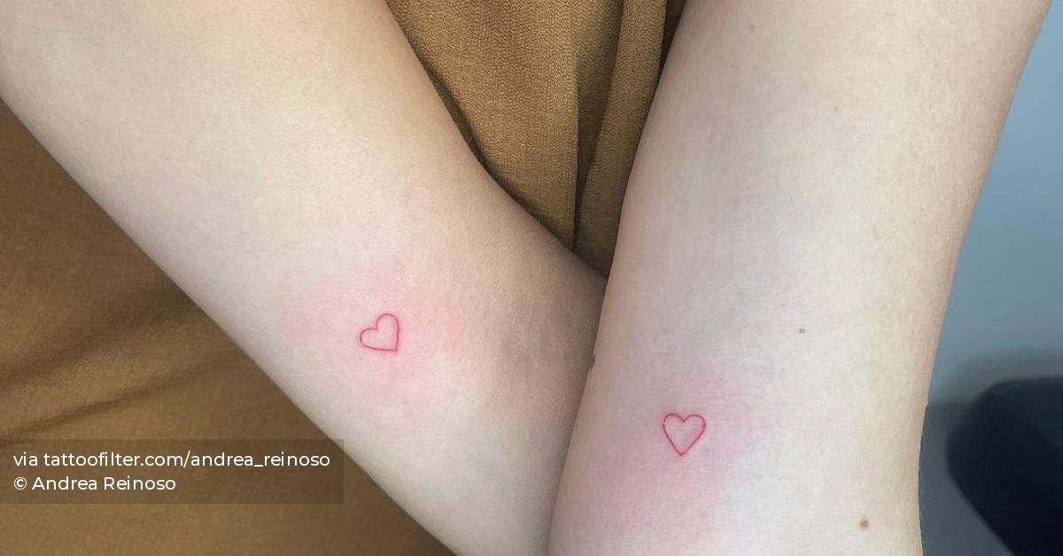 Matching minimalistic red heart tattoo for best