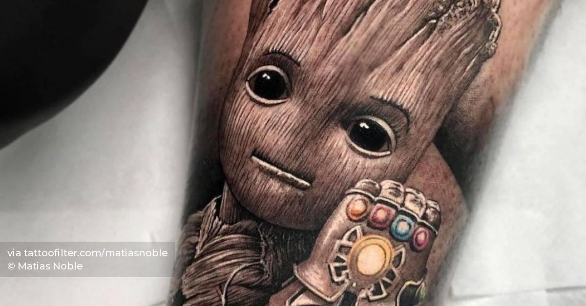 Groot and Infinity Gauntlet tattoo located on the shin.