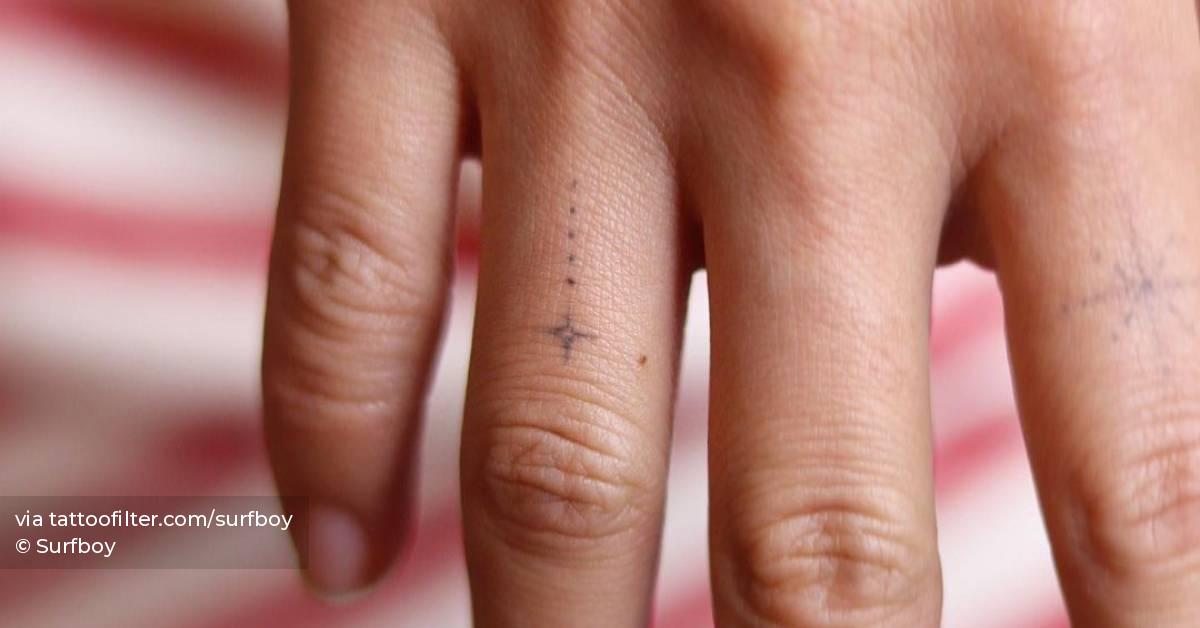 Healed hand poked finger ornament tattoo.