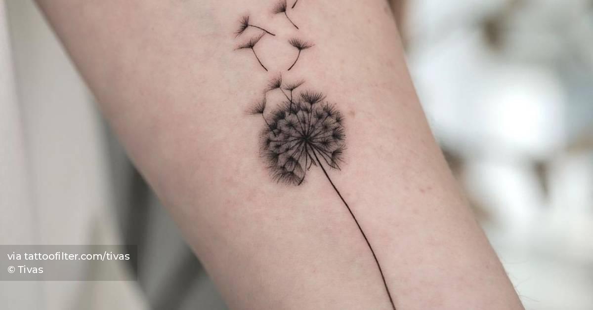 Micro-realistic style dandelion tattoo located on the