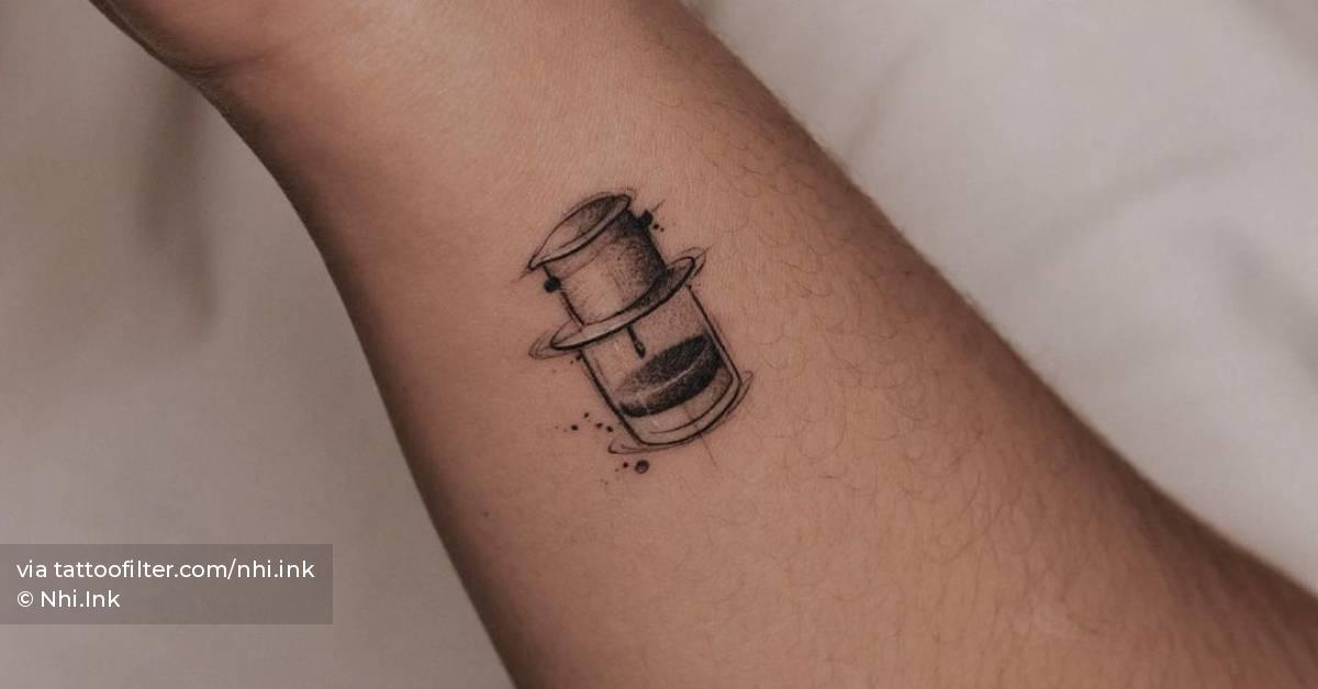 Micro-realistic style coffee filter tattoo located on