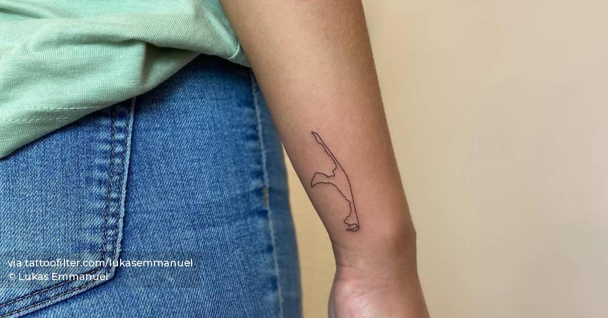 Fine line map tattoo located on the wrist.