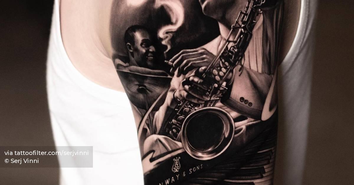Dexter Gordon tattoo located on the upper arm, black