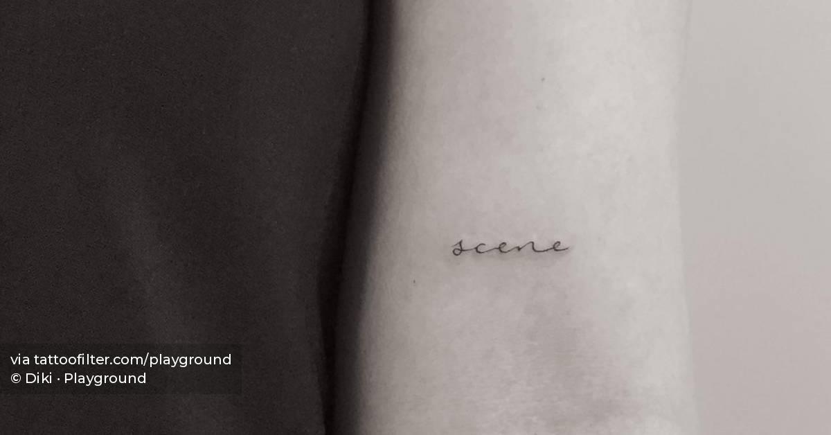 "Scene" lettering tattoo handwritten on the bicep.