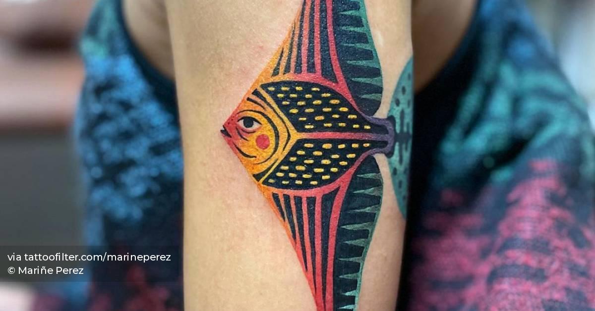 Moorish idol fish tattoo located on the upper arm.