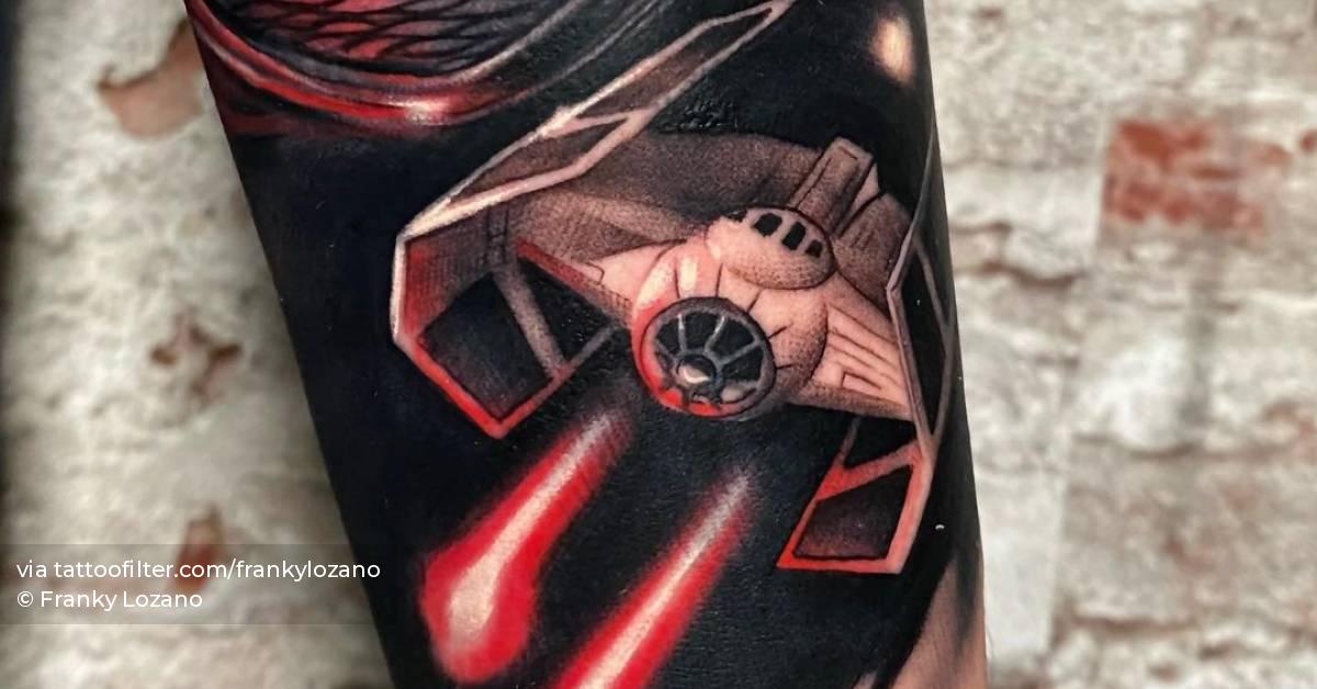 Realistic TIE fighter tattoo located on the wrist.