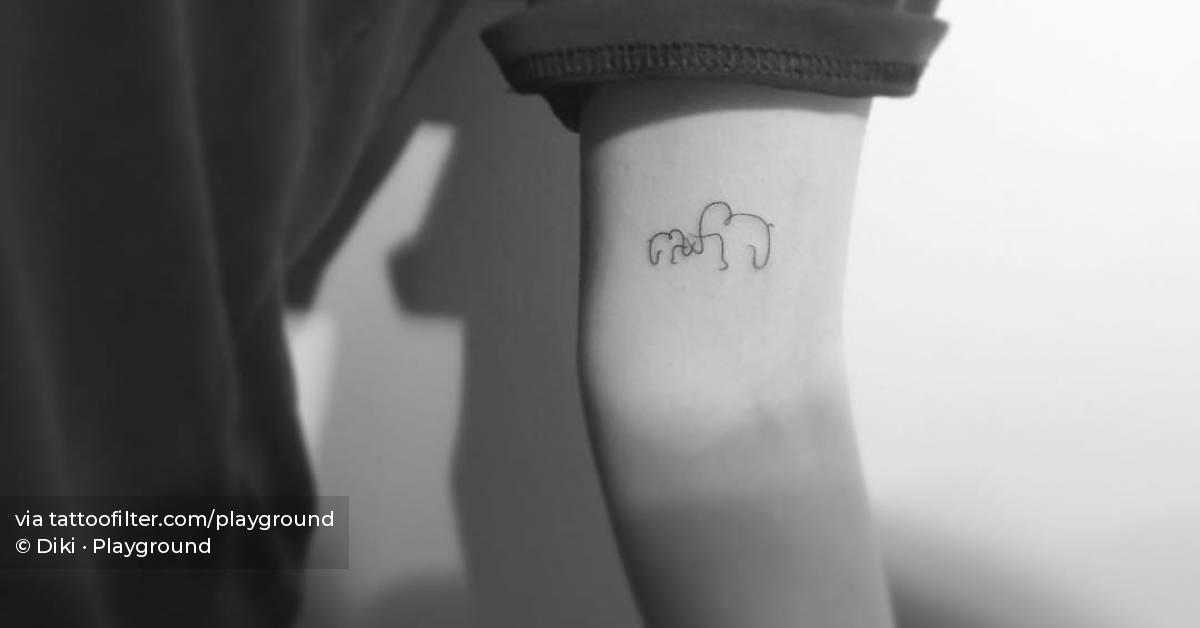 Fine line elephant family tattoo located on the inner