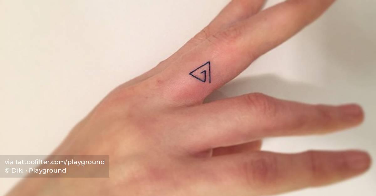 SVT logo tattooed on the finger, minimalistic style.