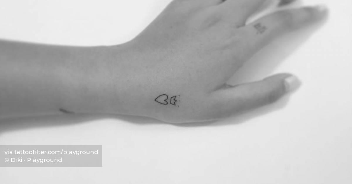Heart and crown tattoo done on the hand, minimalistic