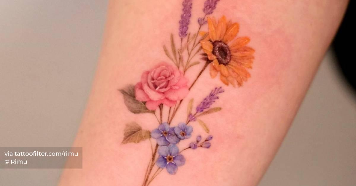 Micro-realistic flower bouquet tattoo located on the