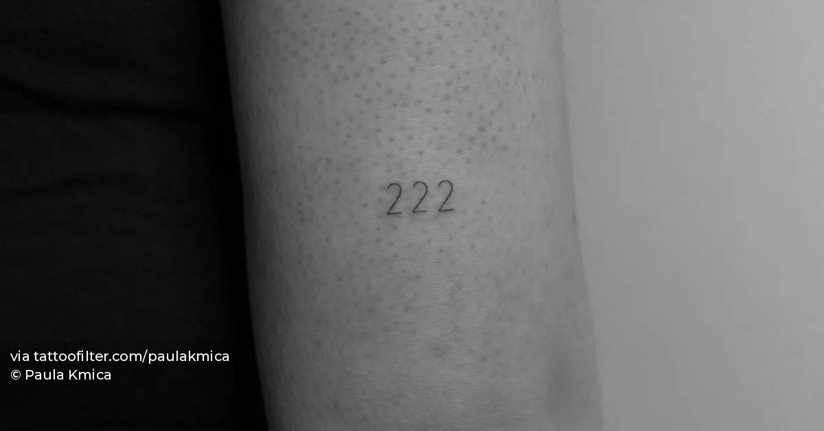 Tattoo of the angel number "222" located on the tricep.