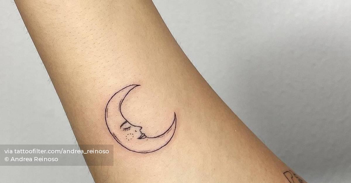 Fine line style moon face tattoo placed on the inner
