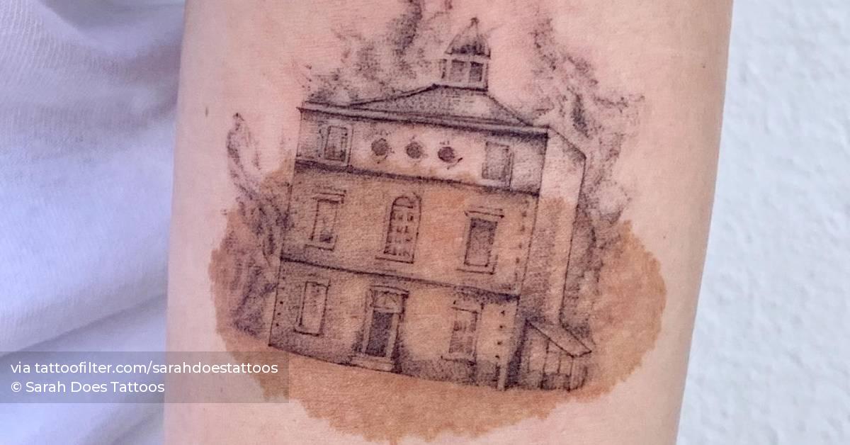 'The House' tattoo located on the forearm.