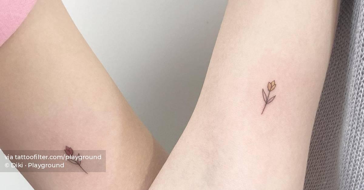 Matching minimalistic flower tattoo for best friends.