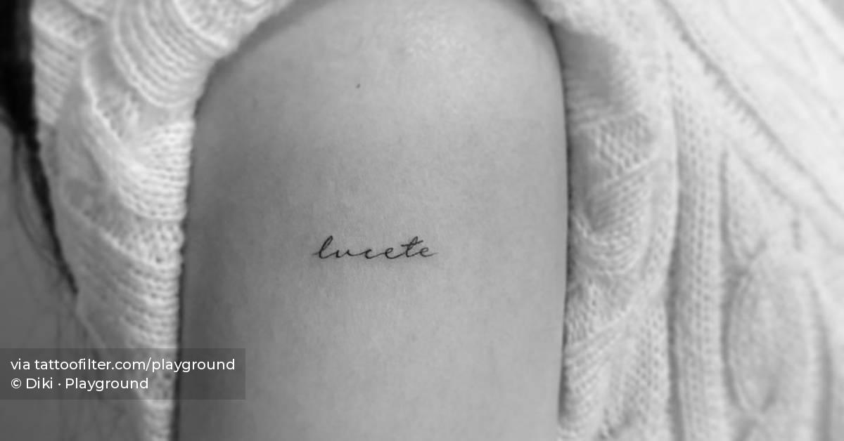 "Lucete" lettering tattoo located on the upper arm.