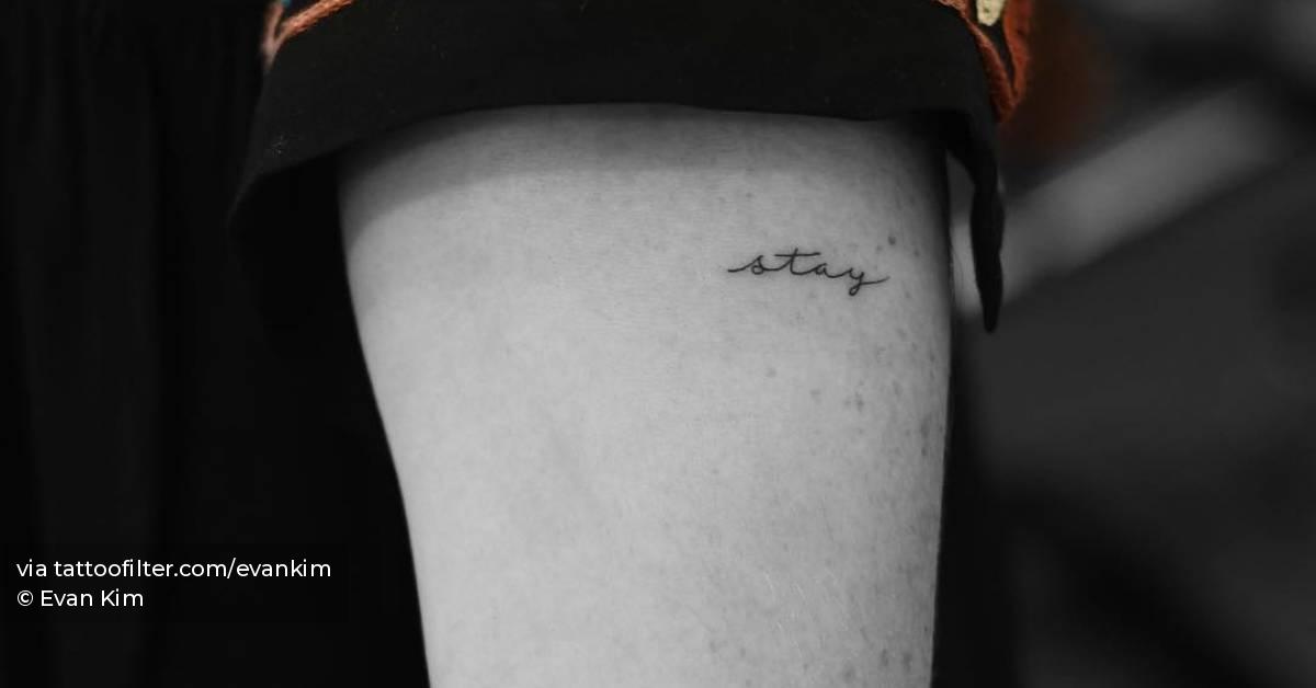 Tattoo of the word "stay" located on the inner forearm.