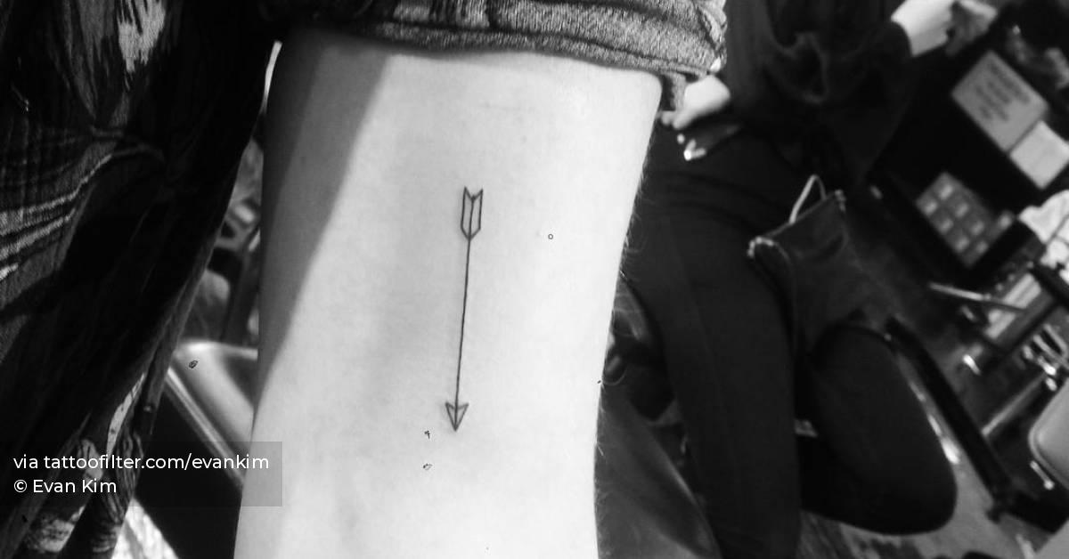 Fine line arrow tattoo placed on the inner arm,
