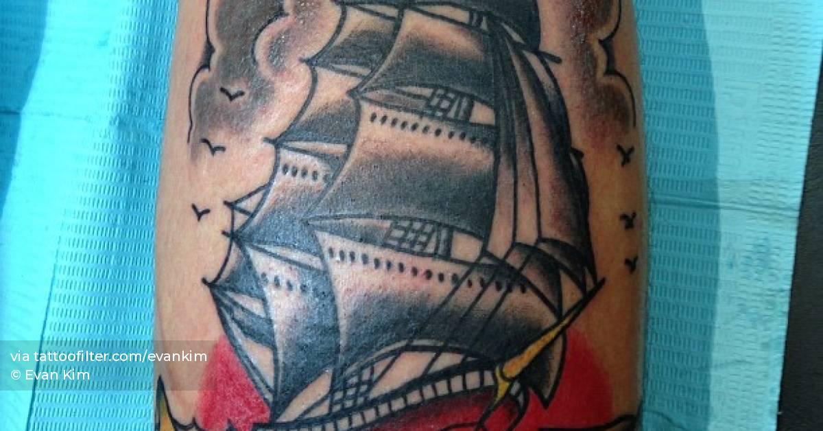 Sailor jerry ship tattooed on the calf, traditional