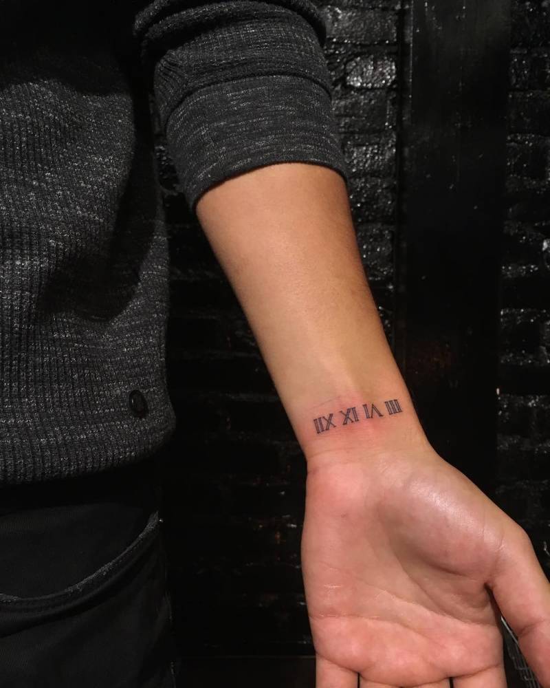 Roman Numerals Tattooed On The Wrist 