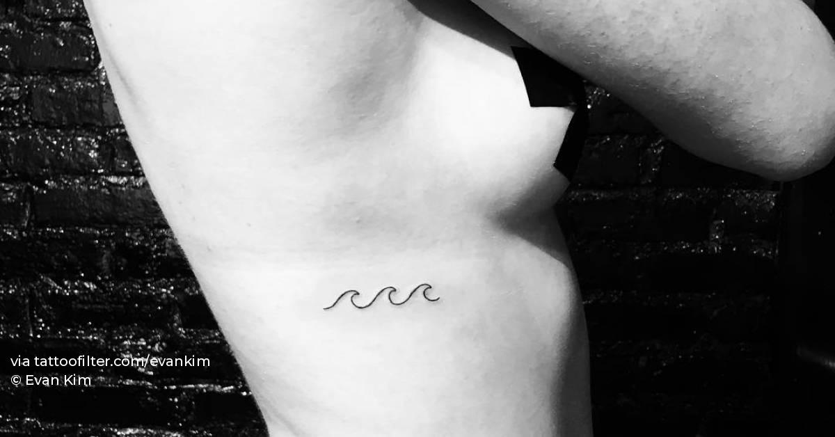 Minimalistic style waves tattooed on the rib.