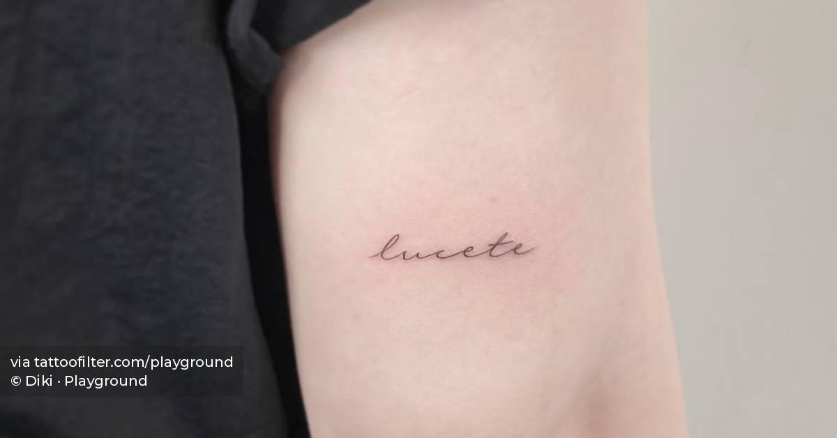 Tattoo of the word "lucete" located on the tricep.