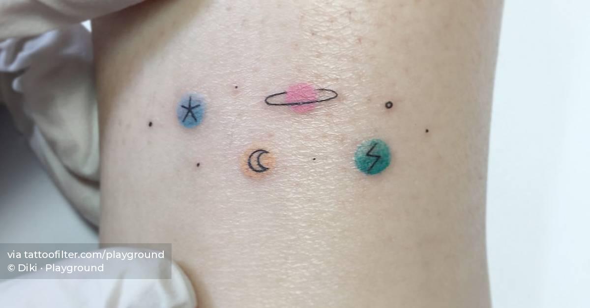 Minimalistic universe tattoo located on the ankle.