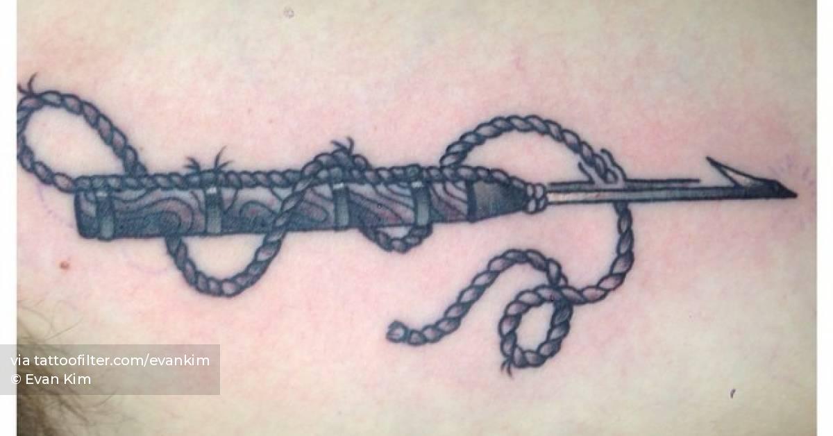 Harpoon tattoo located on the inner arm, illustrative