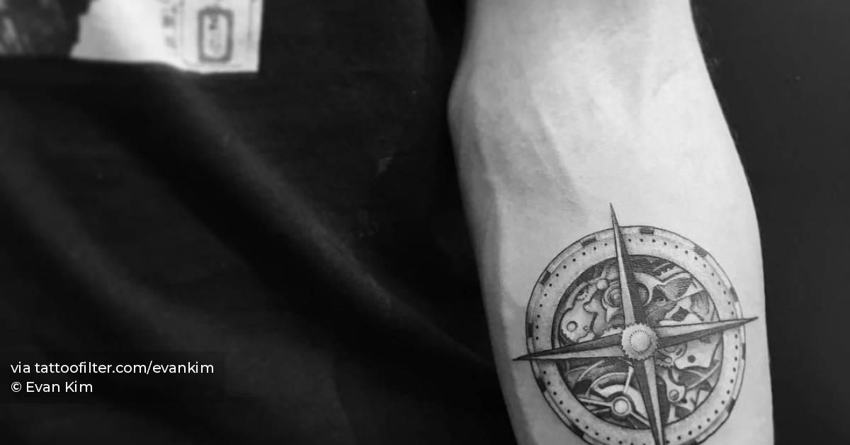 Illustrative style compass tattoo located on the inner