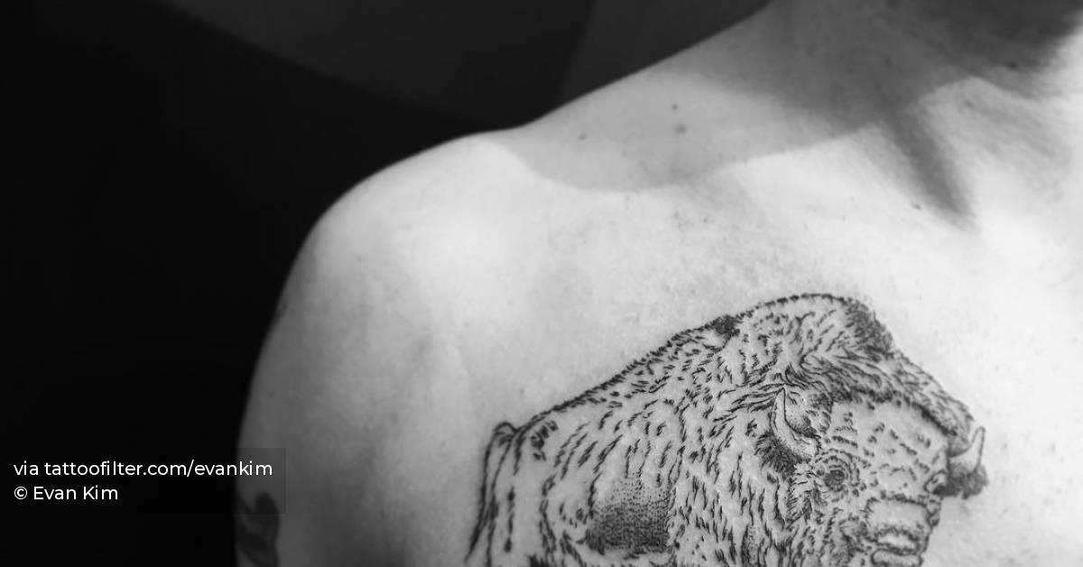 Buffalo tattoo located on the chest.