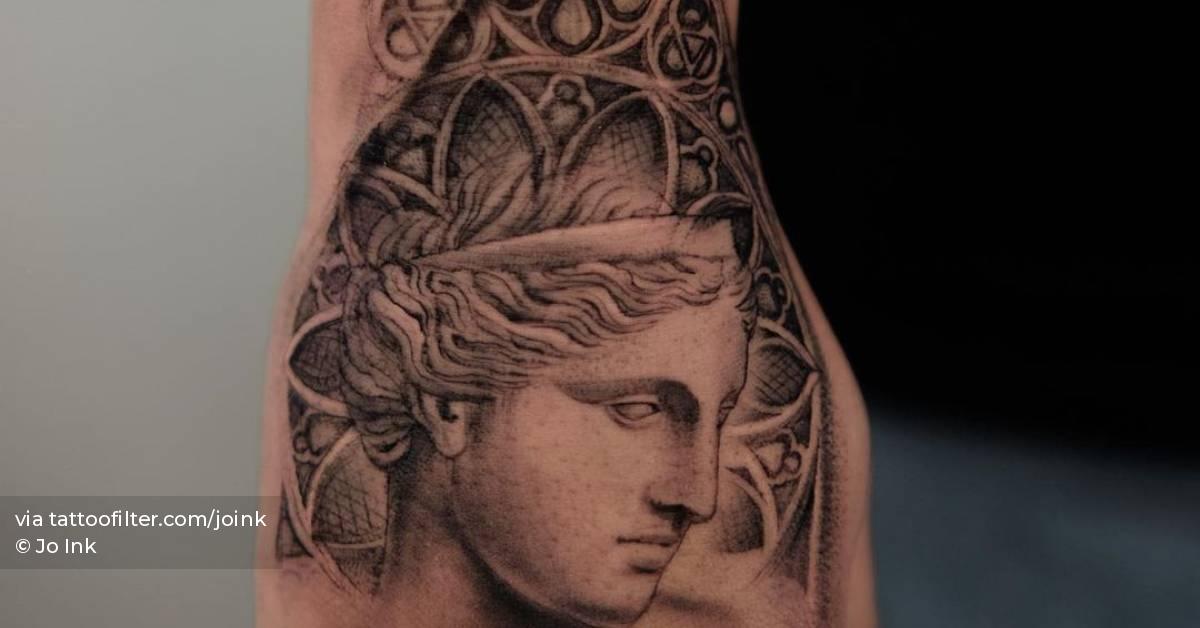 Venus de Milo tattoo located on the hand, black and