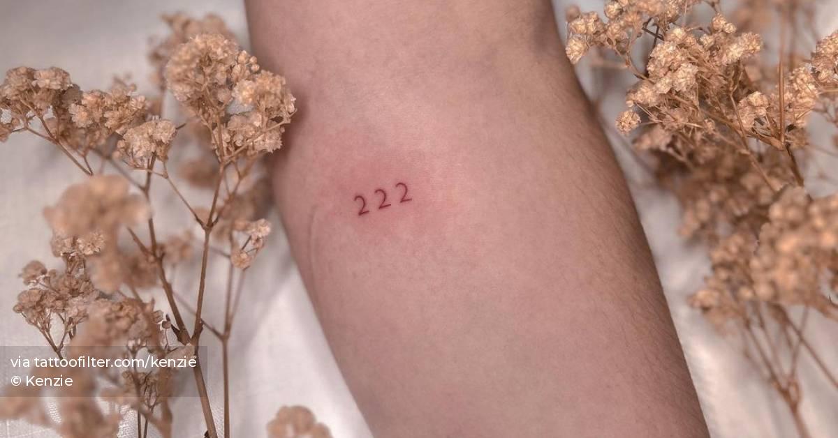 Tattoo of the number "222" located on the inner
