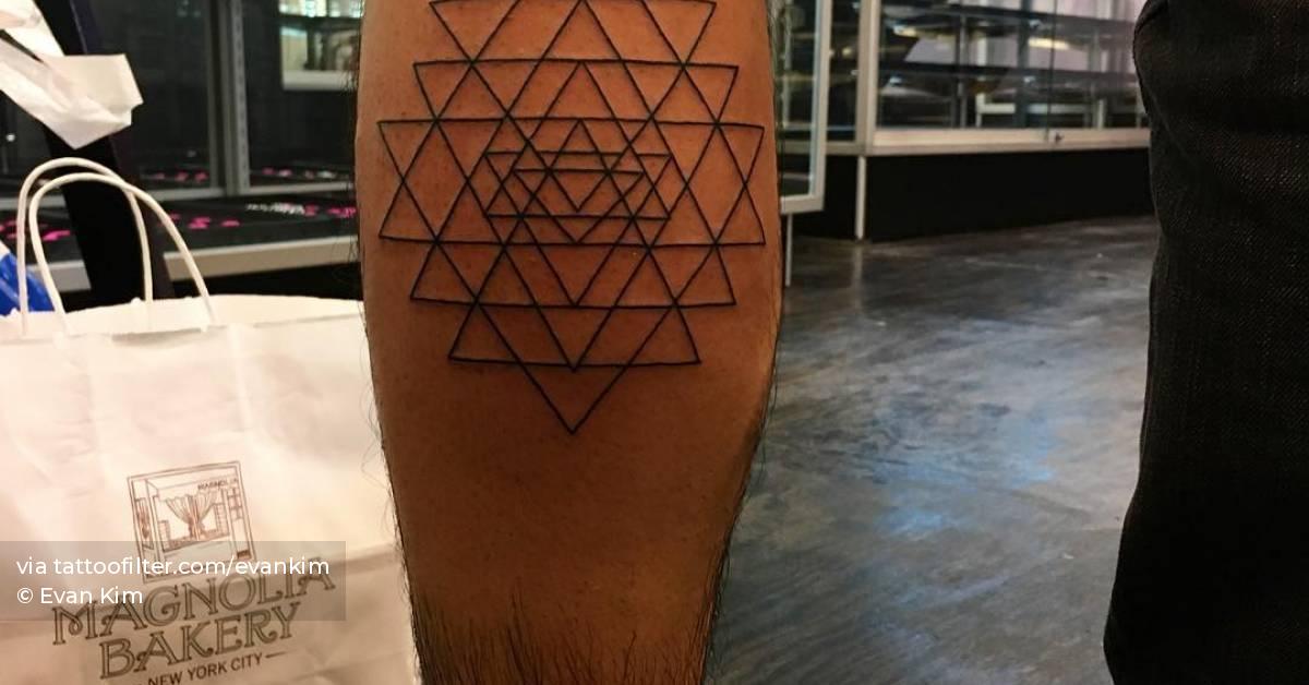 Sri Yantra tattoo located on the calf.