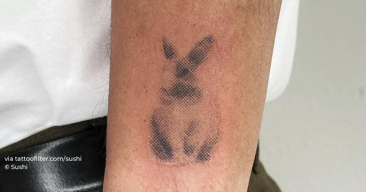Halftone bunny tattoo located on the wrist.
