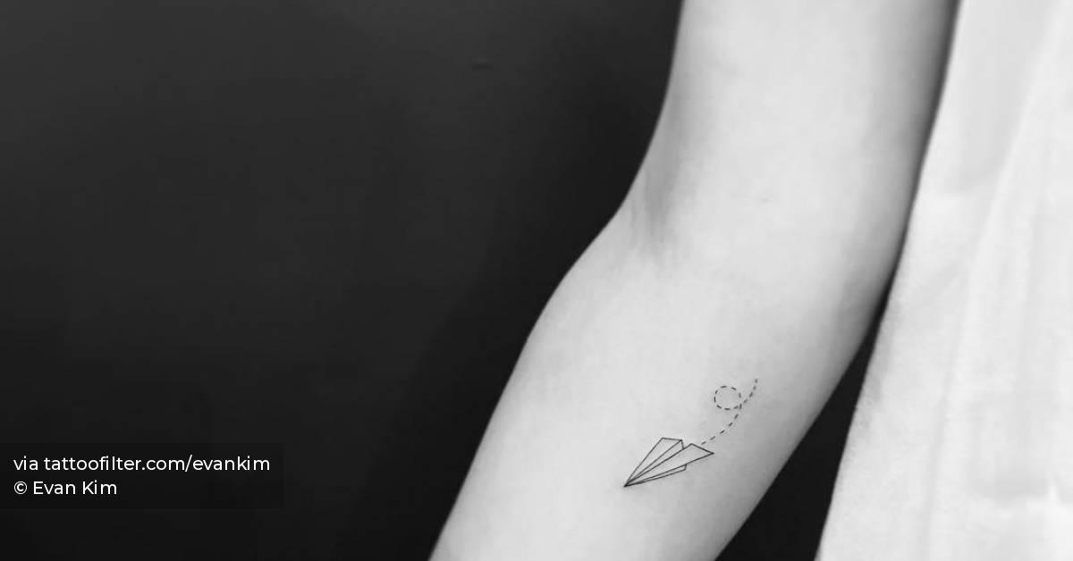 Fine line style paper plane tattoo located on the inner