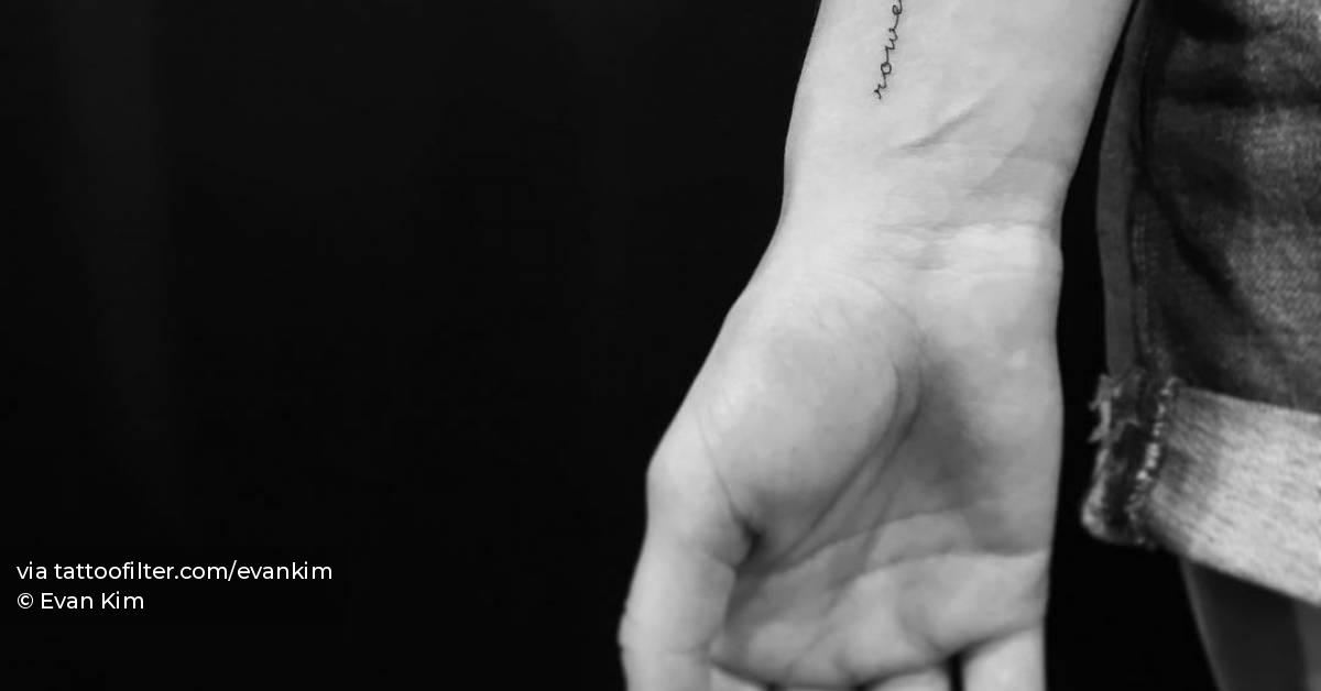 Tattoo of the name "Rowen" located on the wrist.