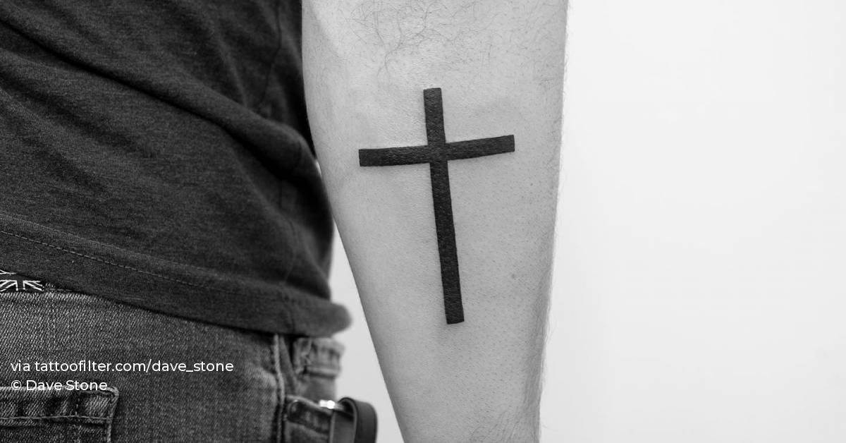 Minimalistic cross tattoo done on the forearm.