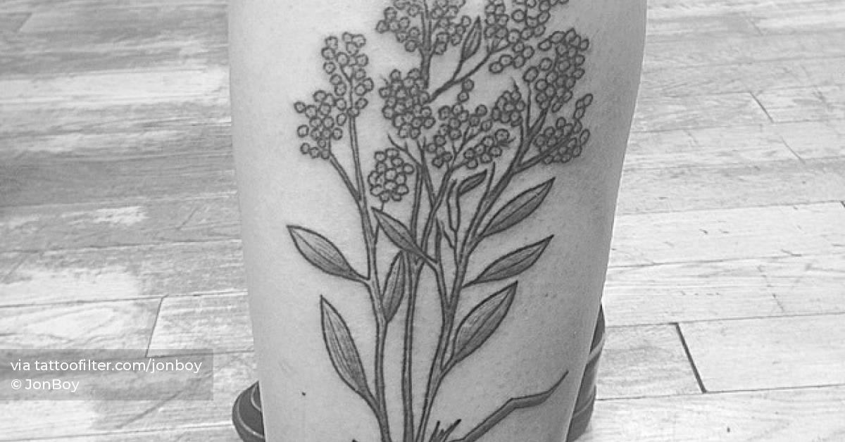 Baby's breath tattoo located on the calf.