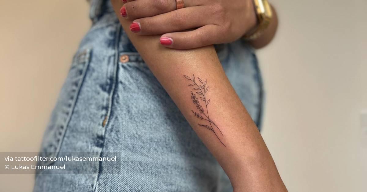 FIne line lavender tattoo located on the wrist.
