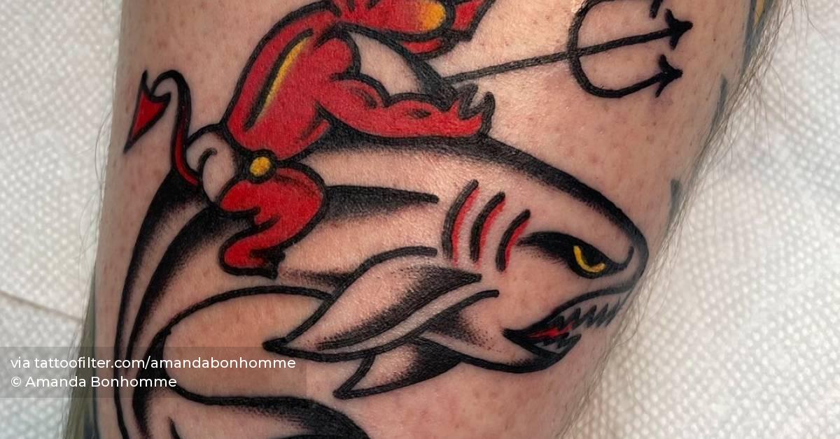 Devil riding a shark.