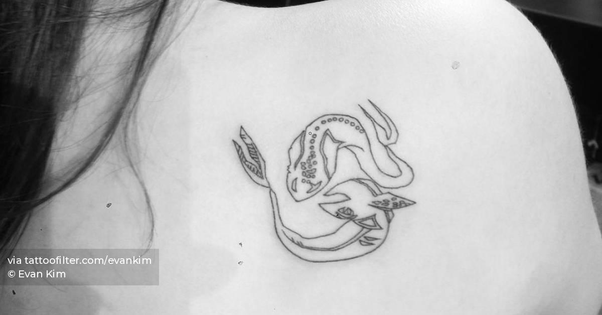 FIne line style two opposite fish tattoo located on the