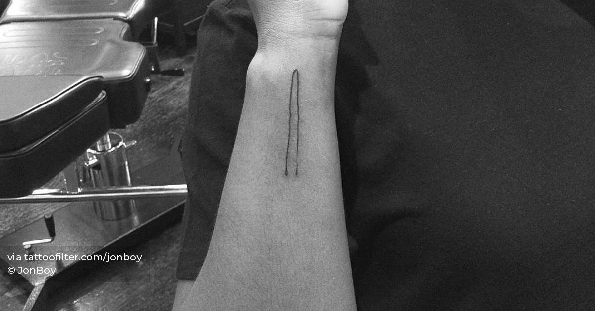 Minimalistic style hair pin tattoo located on the