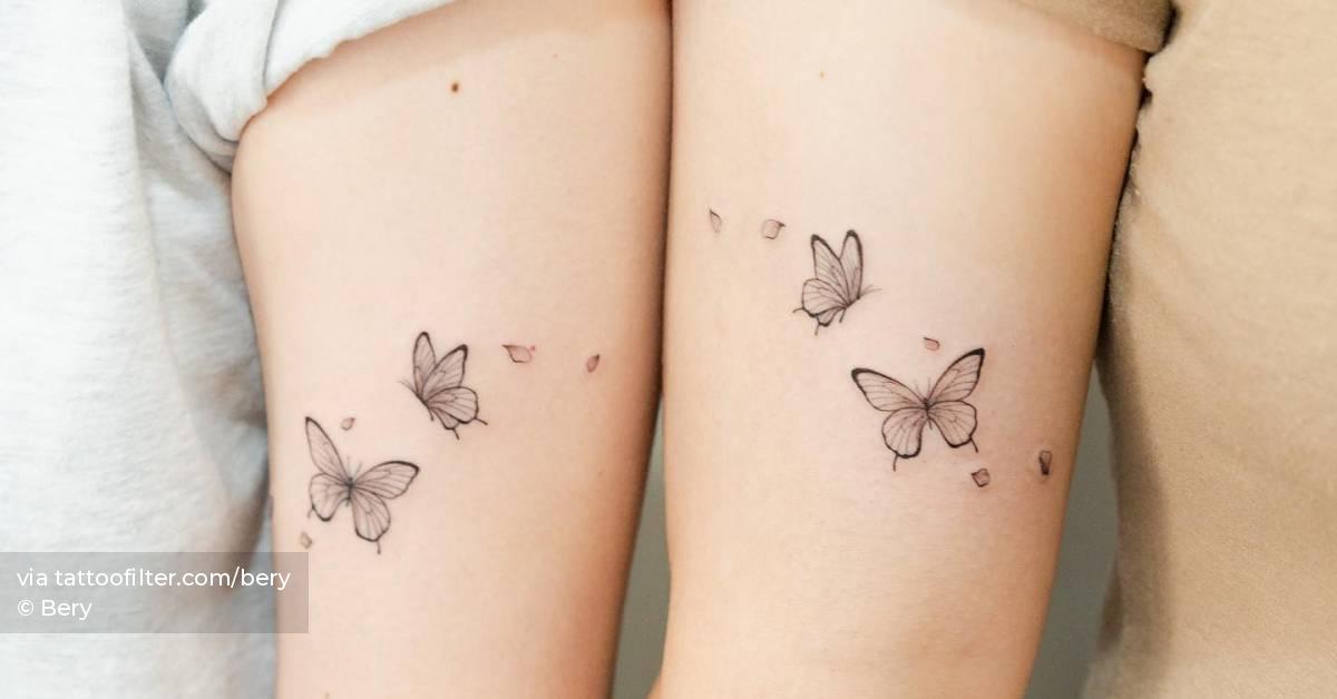 Matching butterfly couple tattoo for sisters.