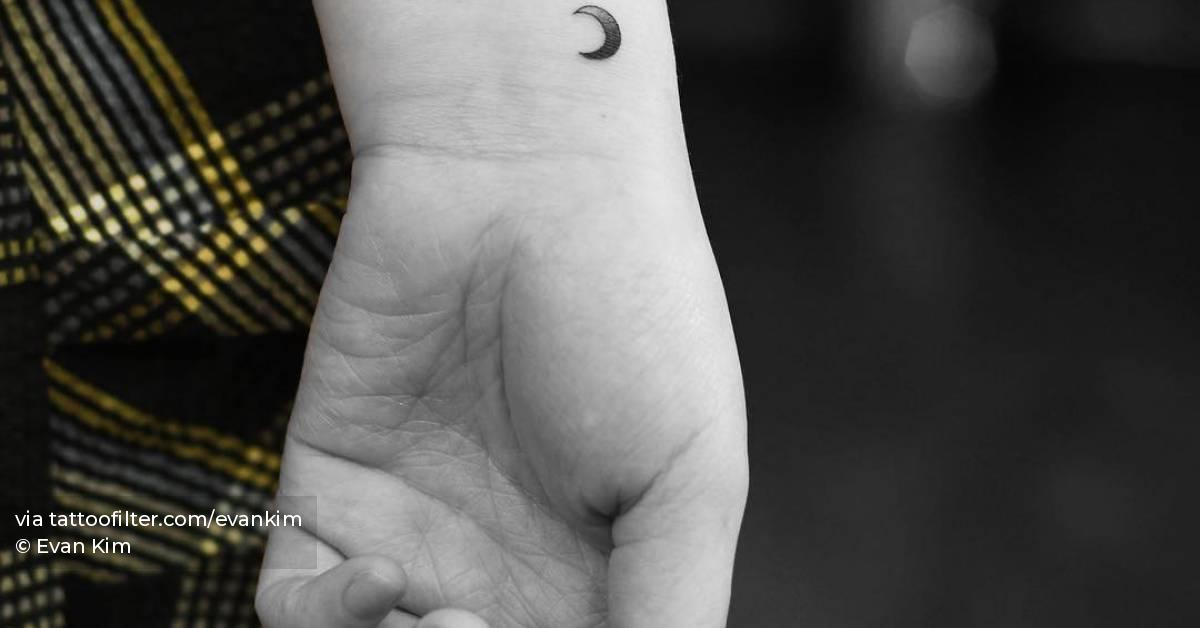 Minimalistic style spectrum moon tattoo located on the