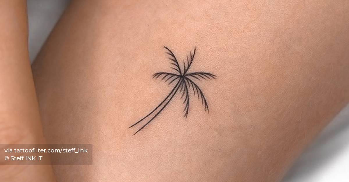 Tiny palm tree tattoo done on the inner arm,
