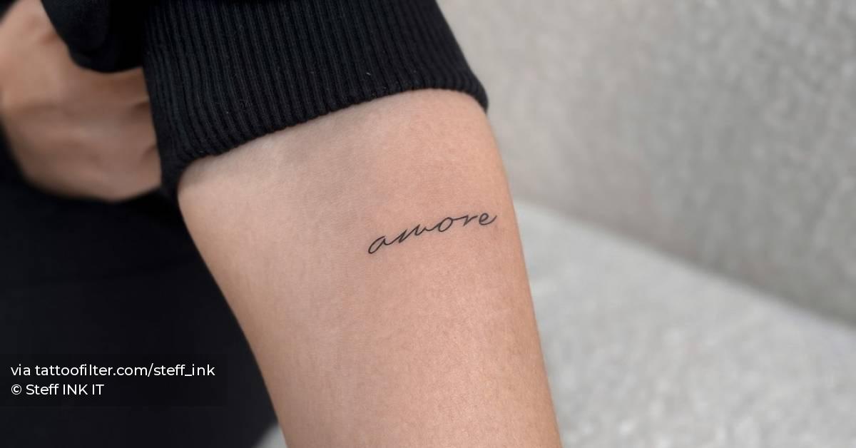 Tattoo of the word "amore" located on the inner