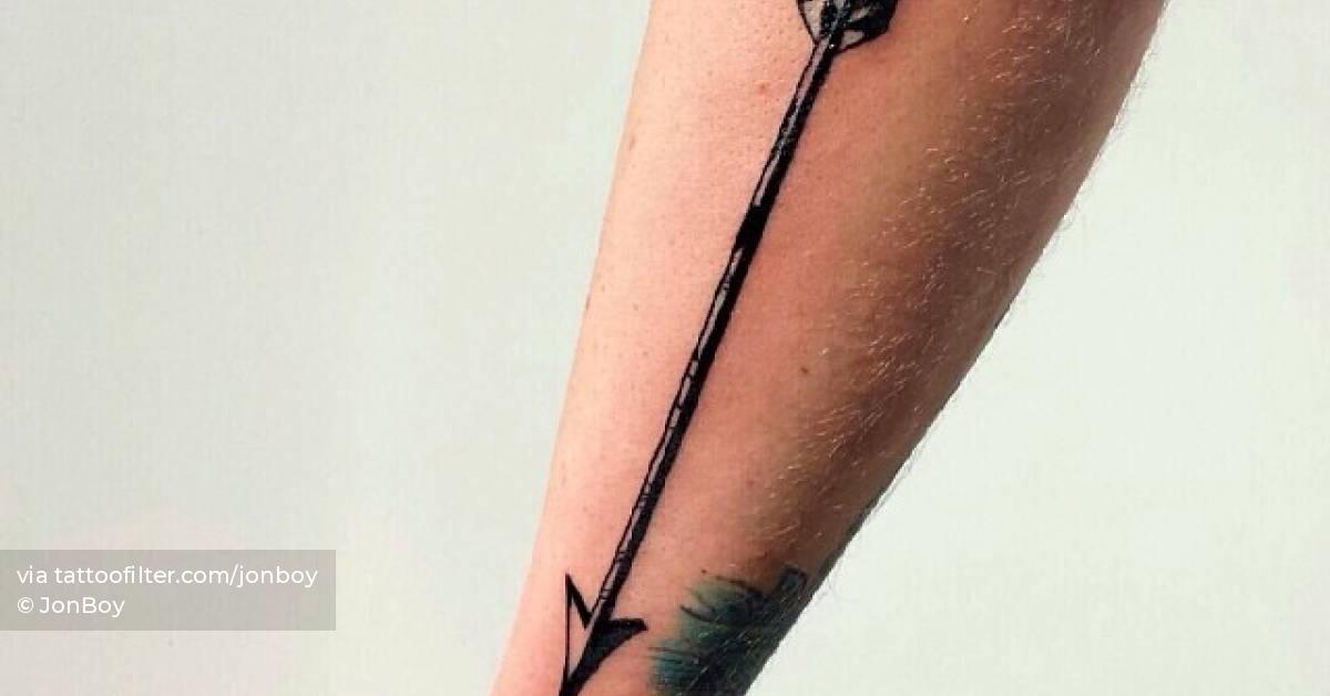 Arrow tattoo located on the forearm, blackwork style.