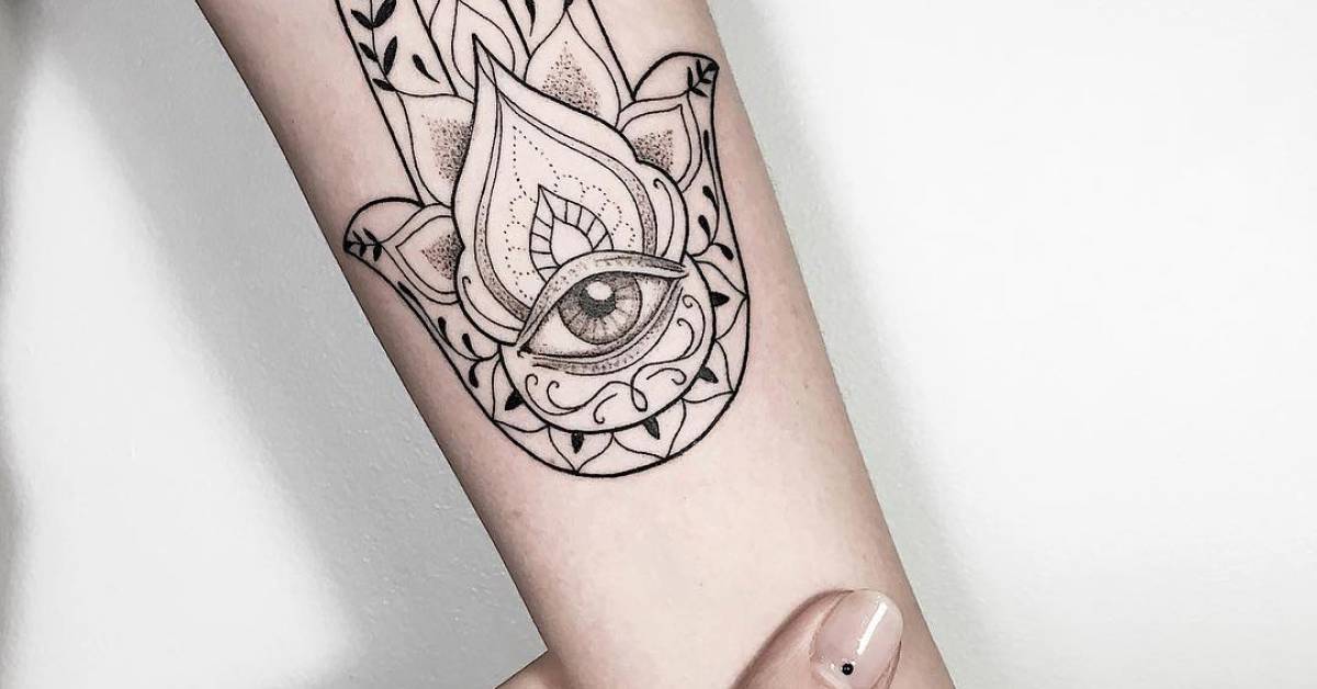 Hamsa tattoo located on the inner forearm.